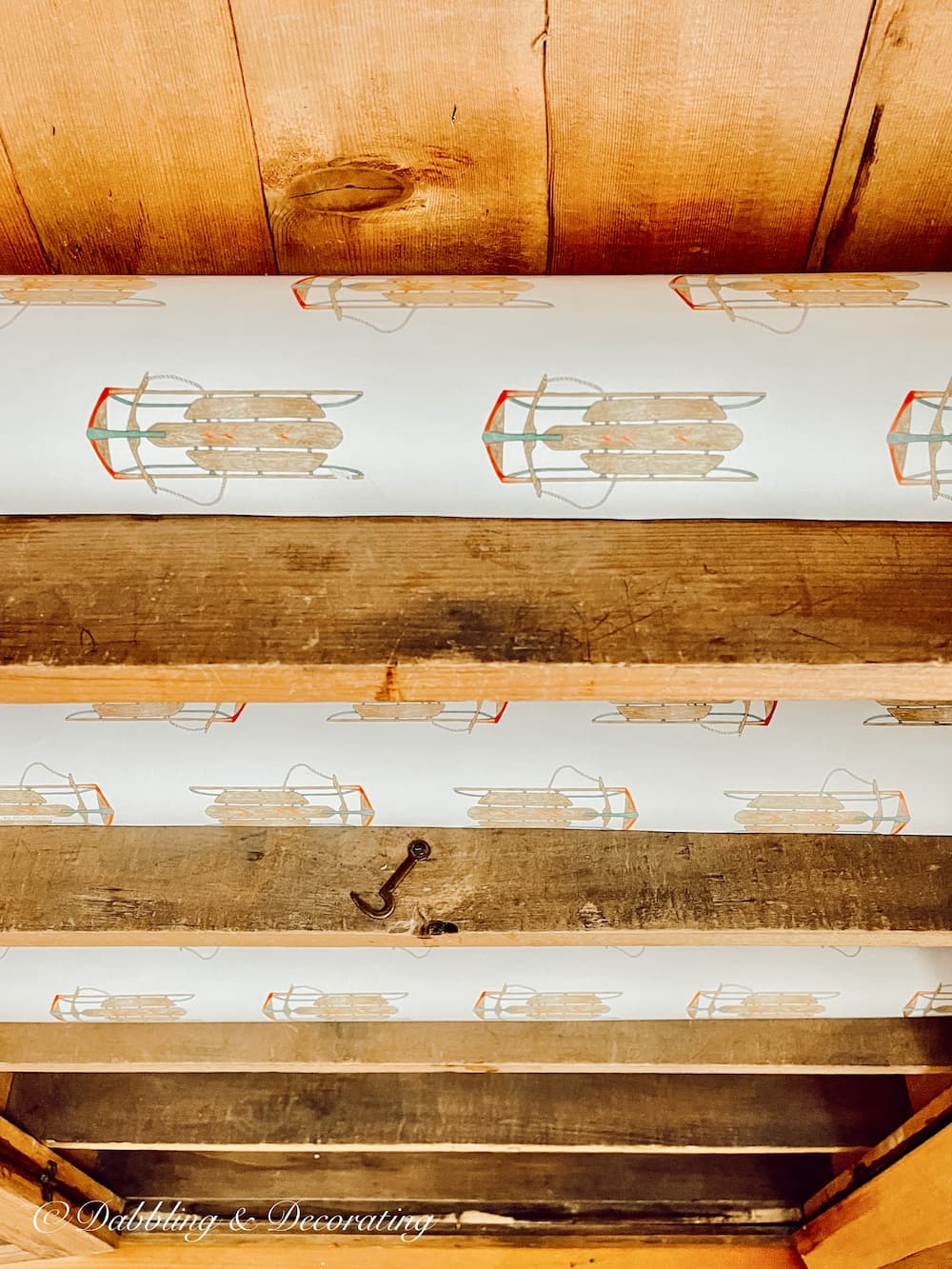 DIY Shelf Liners with Wrapping Paper | A Vintage Ski Lodge Styling Tip