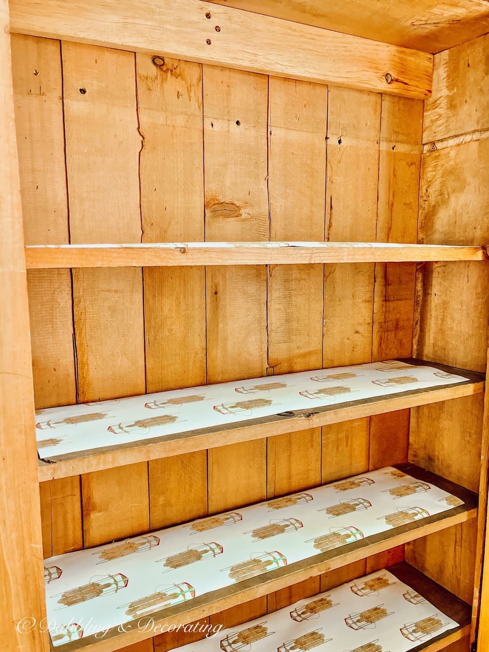 DIY Shelf Liners with Wrapping Paper | A Vintage Ski Lodge Styling Tip